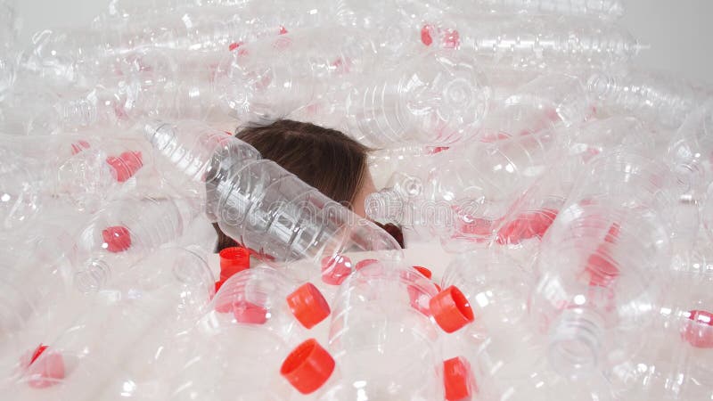 Dehydrated Sick Woman is Lying in a Pile of Plastic Bottles ...