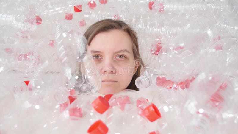 Dehydrated Sick Woman is Lying in a Pile of Plastic Bottles ...