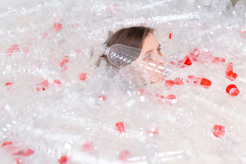 Dehydrated Sick Woman is Lying in a Pile of Plastic Bottles ...