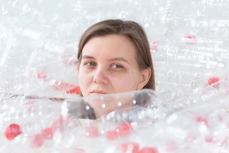 Dehydrated Sick Woman is Lying in a Pile of Plastic Bottles ...