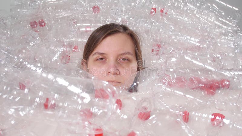 Dehydrated Sick Woman is Lying in a Pile of Plastic Bottles ...