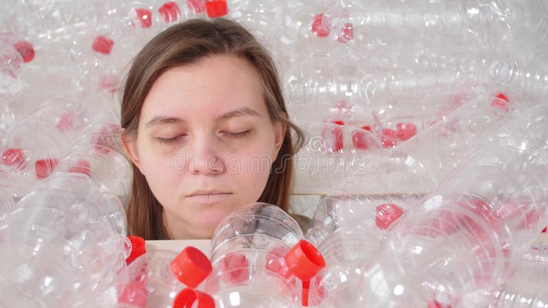 Dehydrated Sick Woman is Lying in a Pile of Plastic Bottles ...