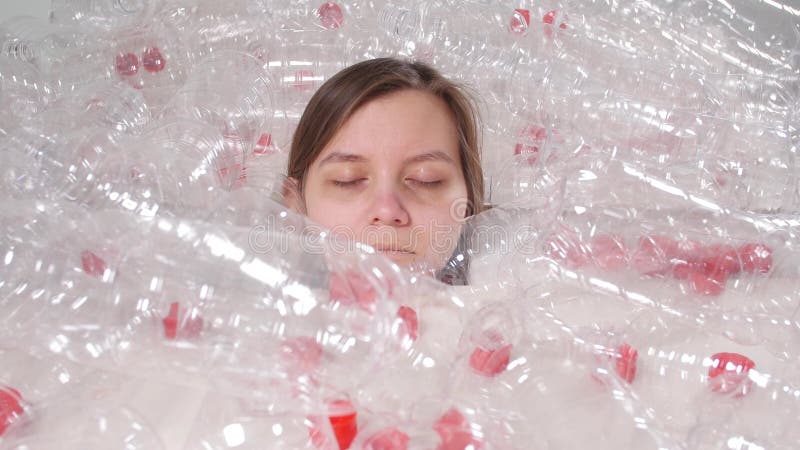 Dehydrated Sick Woman is Lying in a Pile of Plastic Bottles ...