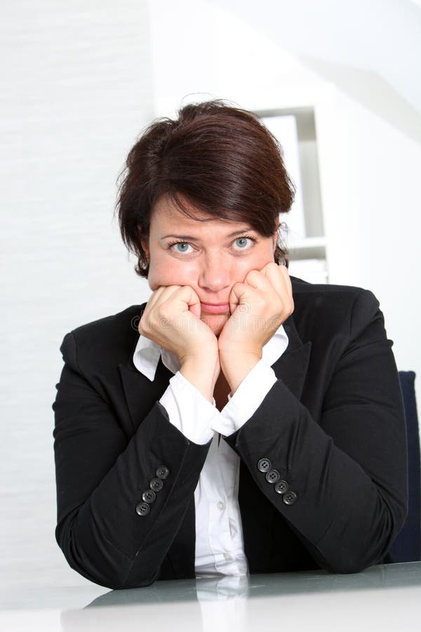 Dejected Businesswoman Seated at Her Desk Stock Image - Image of ...