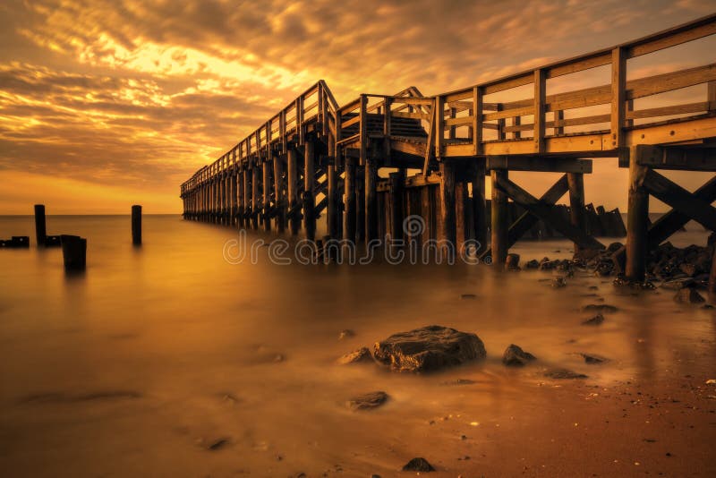 Delaware Bay Fishing Pier stock photo. Image of peaceful - 20692308