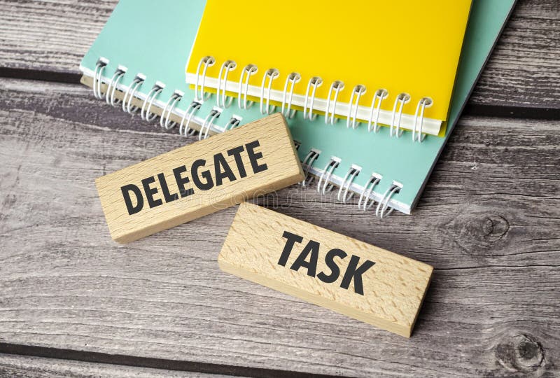 Delegate Task Symbol. Concept Words Return on Assets on Wooden Blocks ...