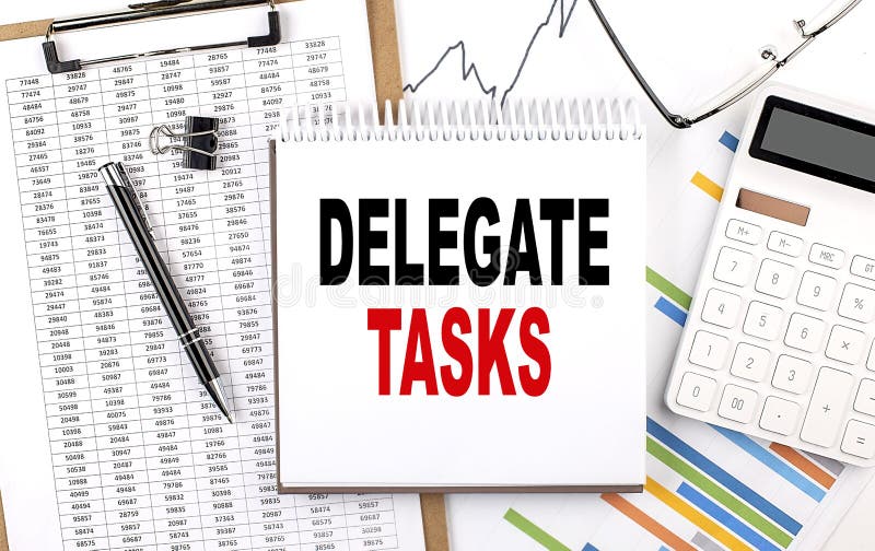 DELEGATE TASKS Text on Notebook with Chart, Calculator and Pen Stock ...