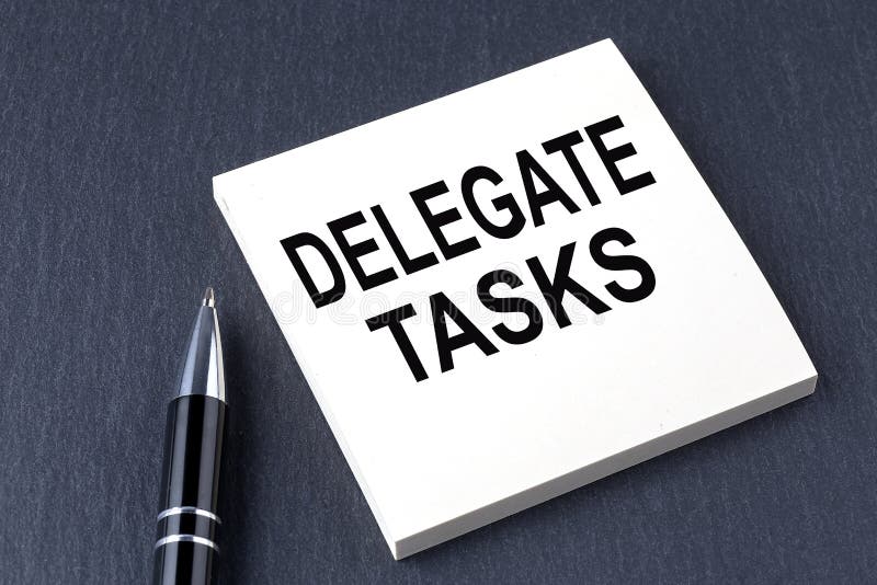 DELEGATE TASKS Text on Notebook with Chart, Calculator and Pen Stock ...