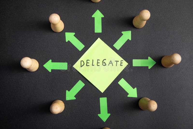 Delegate Word on Sticky Note with a Wooden Human Figures Stock Photo ...