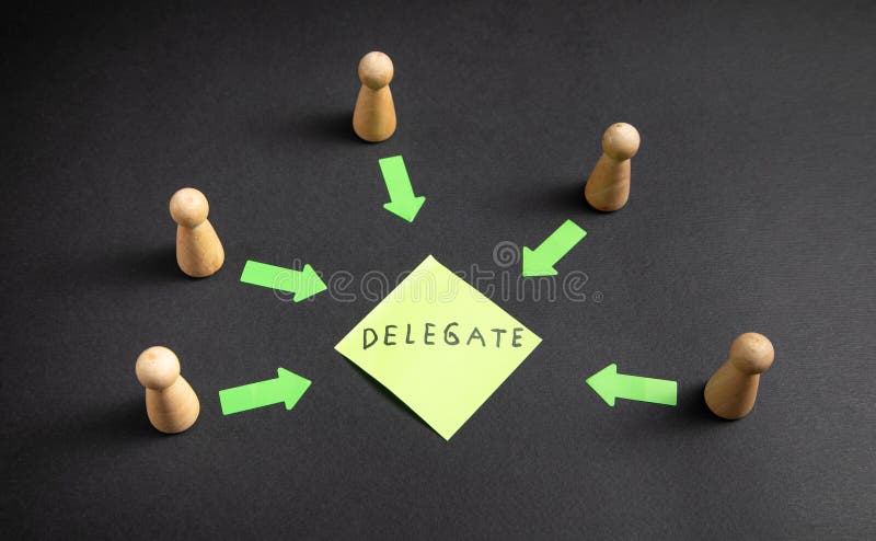Delegate Word on Sticky Note with a Wooden Human Figures Stock Photo ...