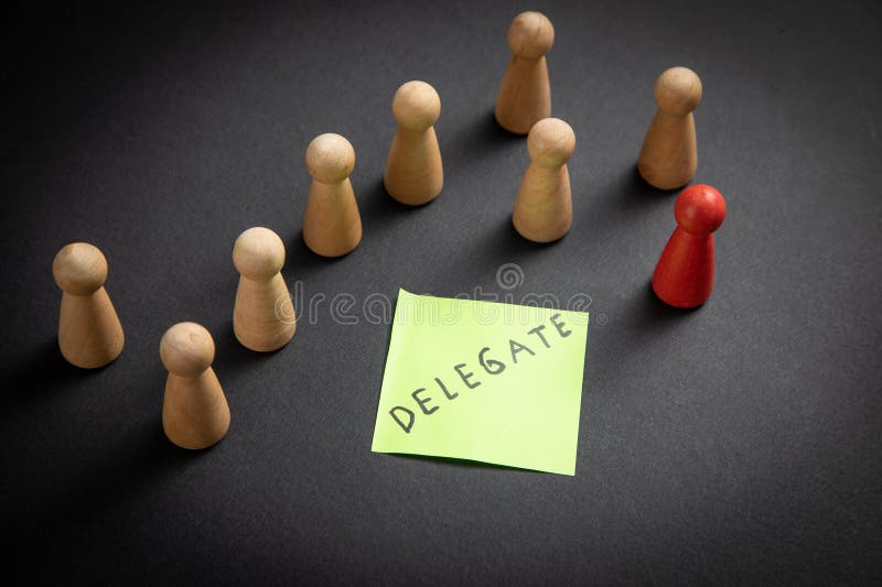 Delegate Word on Sticky Note with a Wooden Human Figures Stock Photo ...