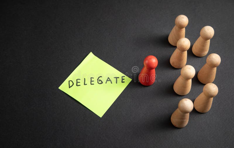 Delegate Word on Sticky Note with a Wooden Human Figures Stock Photo ...