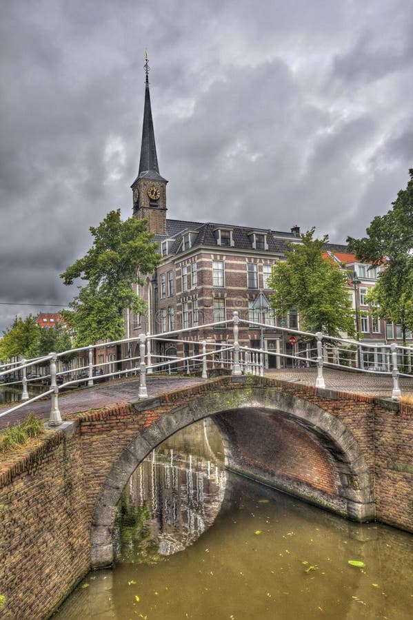 Delft Bridge and Church stock photo. Image of europe - 25605560