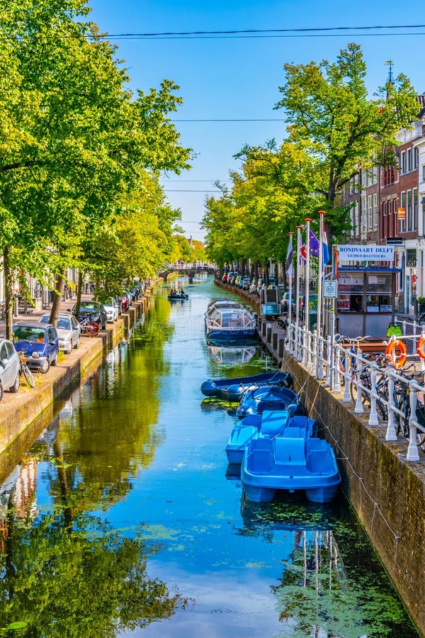 DELFT, NETHERLANDS, AUGUST 6, 2018: Typical Dutch Buildings Alongside a ...