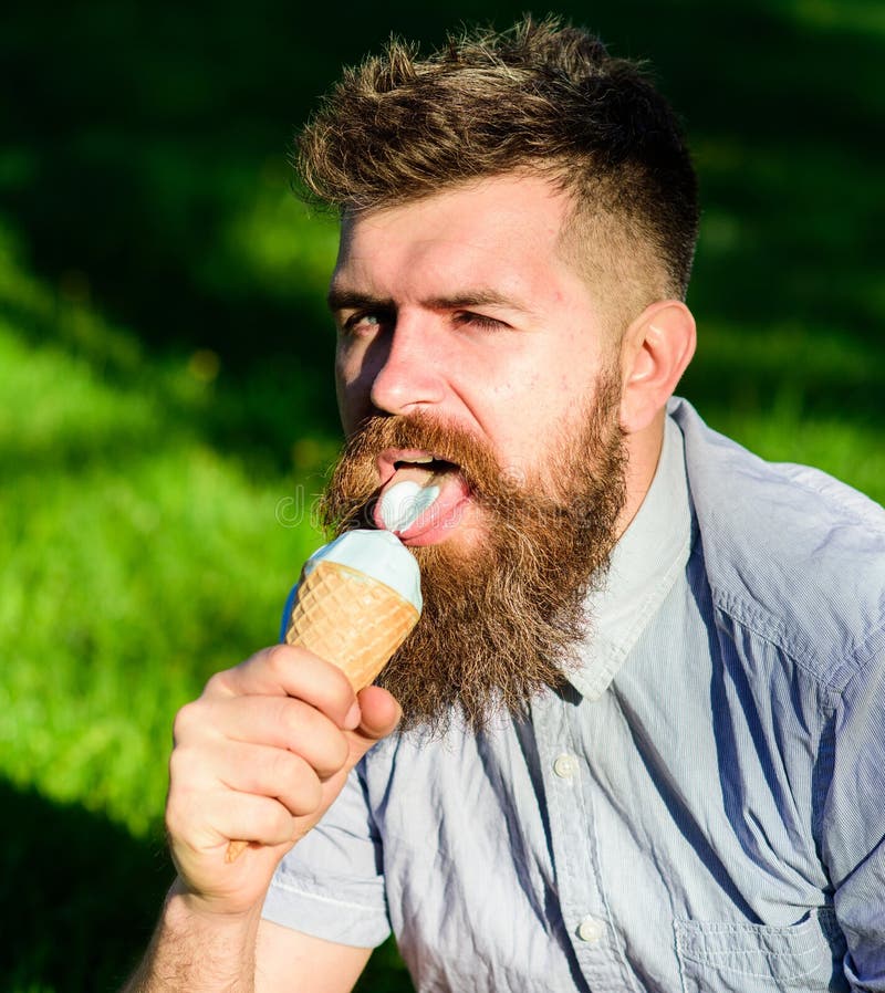 Delicacy Concept Man With Long Beard Eats Ice Cream While Sits On