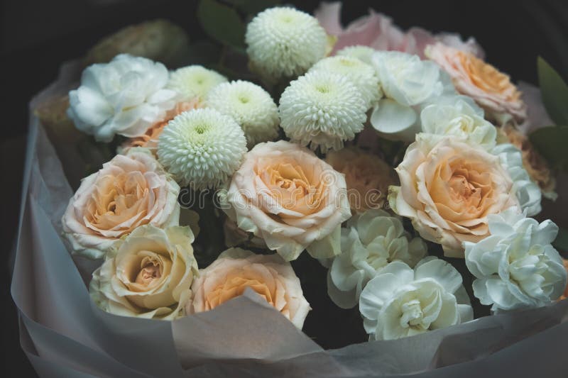 A Delicate Bouquet of Light Beautiful Freshly Cut Roses Wrapped in ...