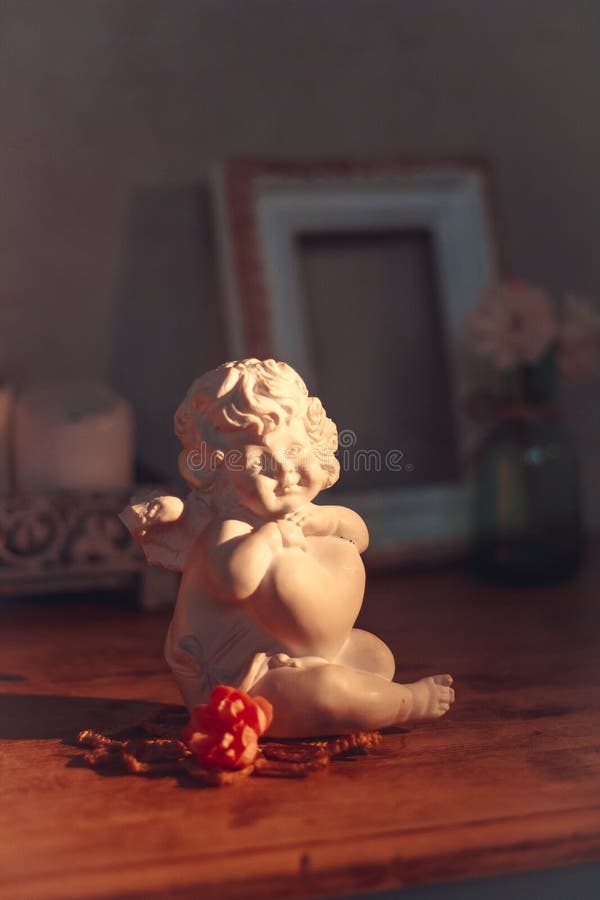 Delicate Composition with a Figure of an Angel Decorated in Rust Stock ...