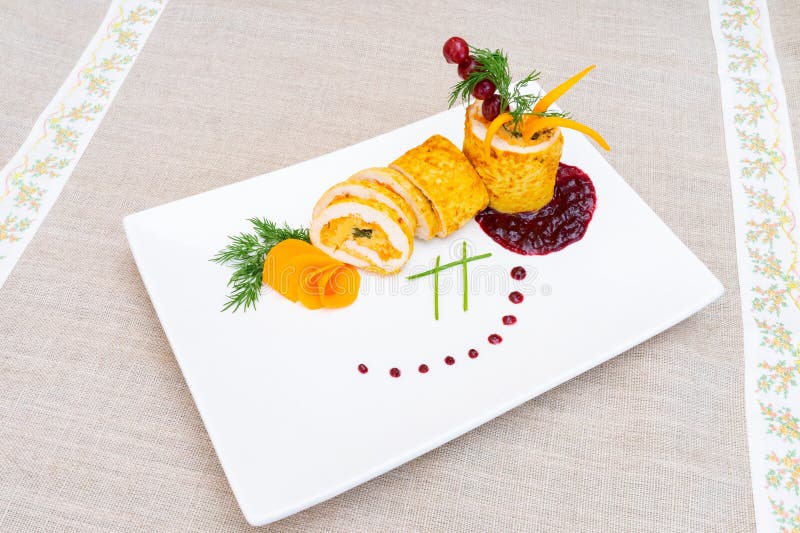 Delicate Culinary Presentation of Rolled Chicken with Garnishes and ...