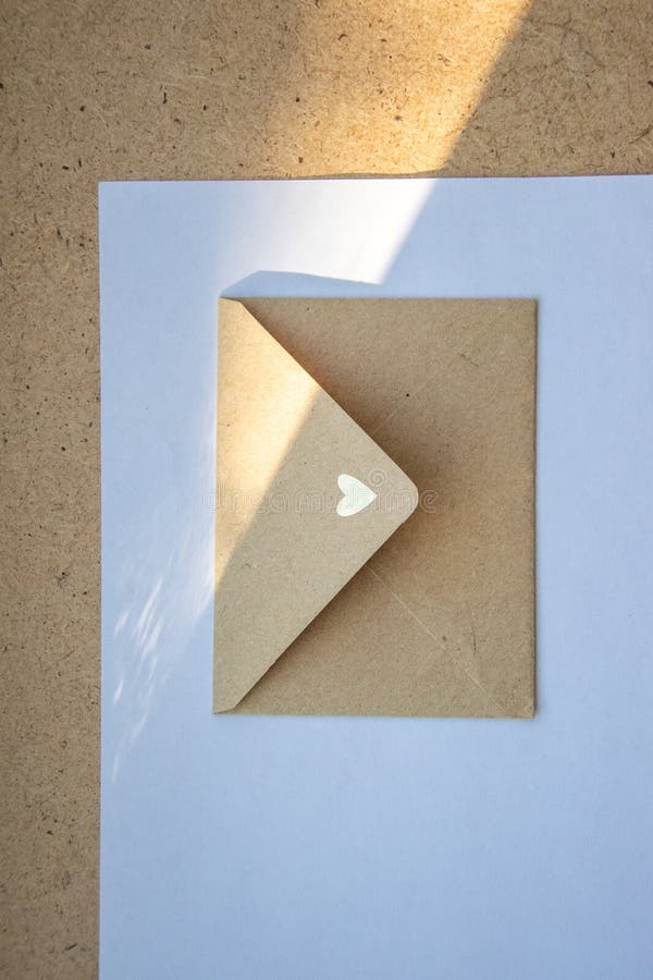 A Delicate Envelope with a Heart Design Partially Opened on a Light ...