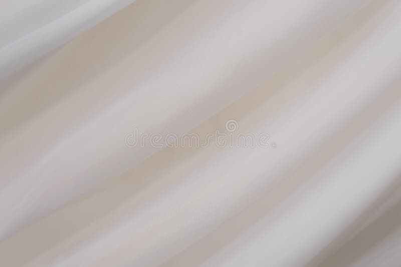 Soft Fabric Draping Elegantly on a Neutral Surface in Warm Light Stock ...