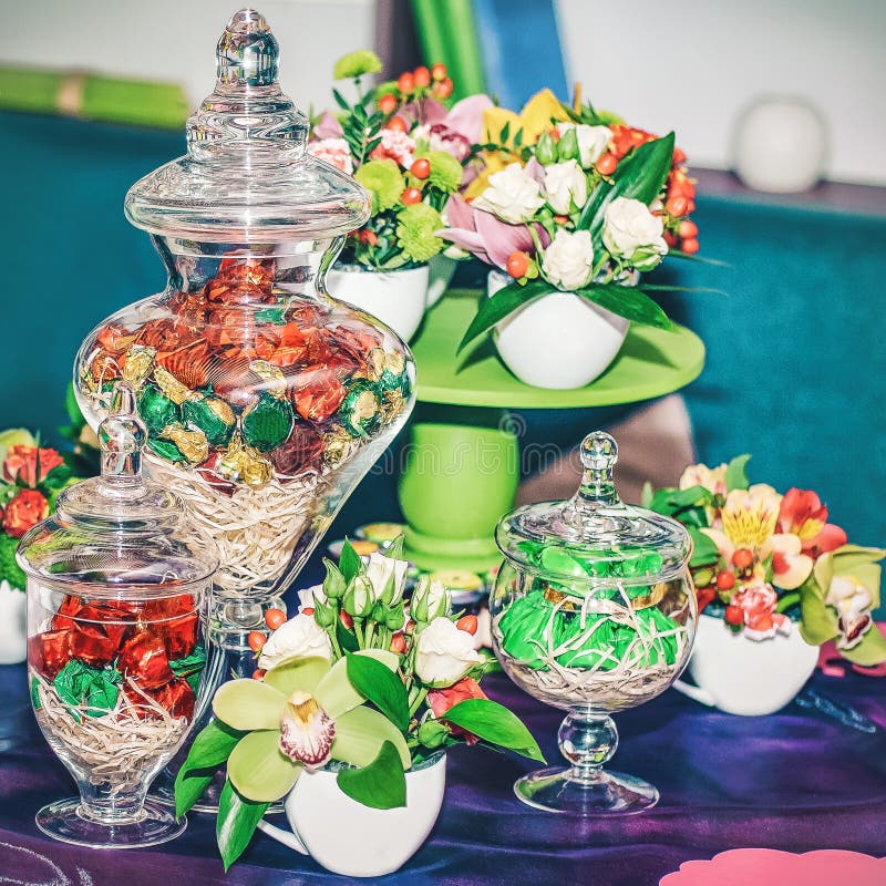 Delicate Flowers and Sweets in Vases on the Table Stock Photo - Image ...