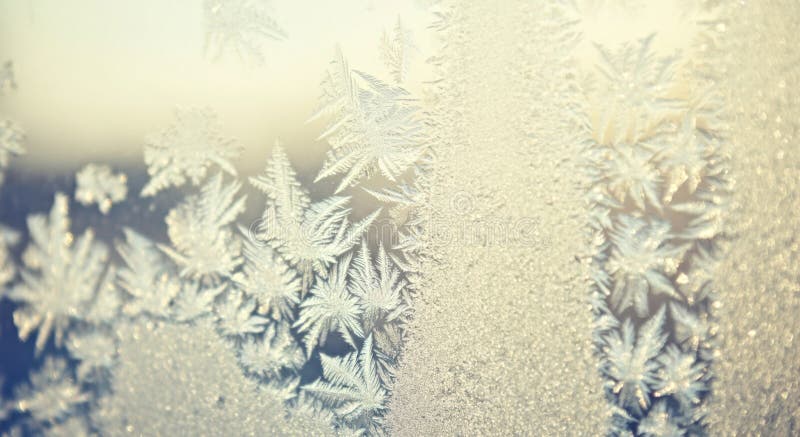 Delicate Frost Patterns Adorn a Glass Winter Surface of Window. Concept ...