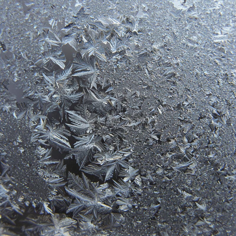 Delicate Frost Patterns Cover a Surface, Displaying Intricate ...