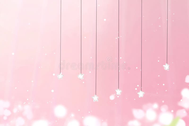 Delicate Hanging Stars Against a Soft Pink Backdrop in a Serene Setting ...
