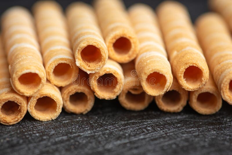 Delicate Rolled Wafer Stacks on Dark Surface Stock Photo - Image of ...