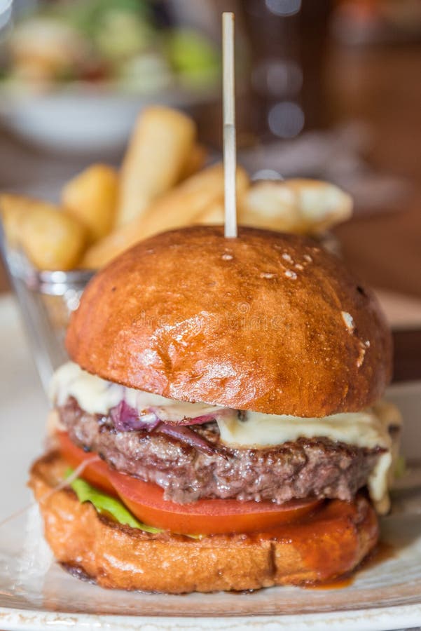 Delicious Hamburger on the Table Stock Image - Image of food, table ...