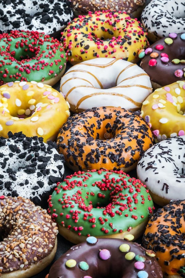 Delicious Assortment of Donuts with Icing and Different Fillings on the ...