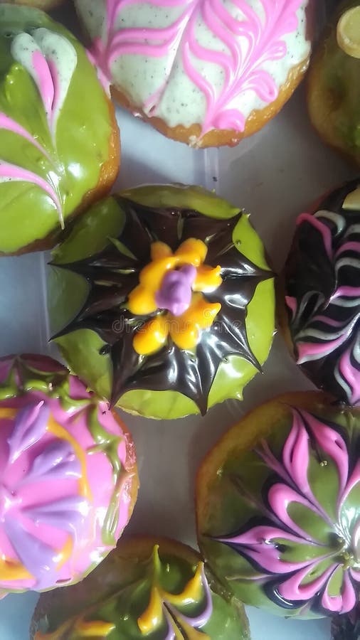 Delicious baby donuts stock image. Image of pink, yellow - 221772865