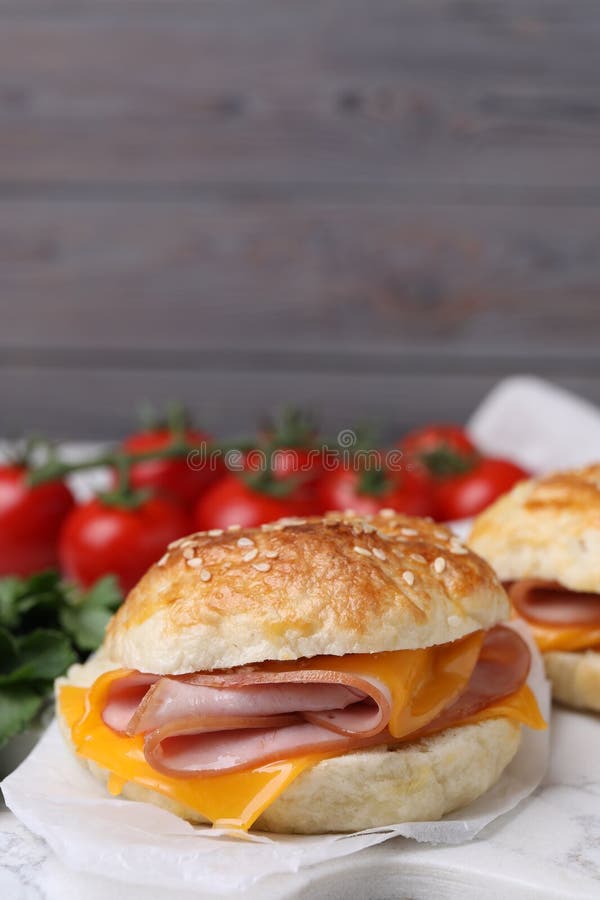 Delicious Bagel with Ham and Cheese on Table. Space for Text Stock ...