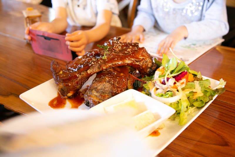 Delicious Barbecue Pork Ribs with Salad Stock Photo - Image of dinner ...