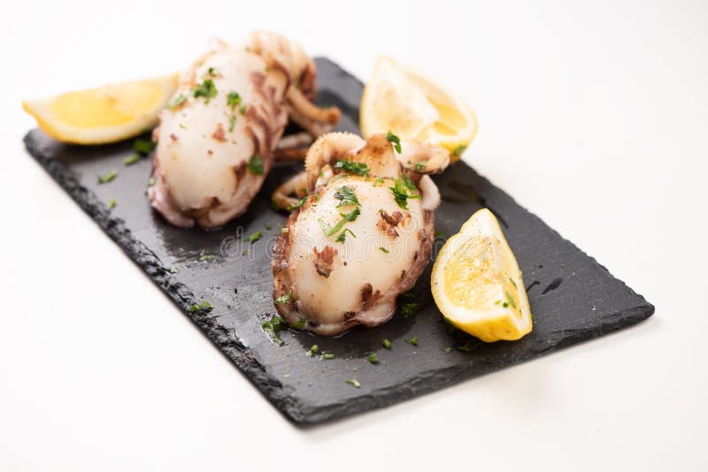 Delicious BBQ Cuttle Fish on a Stone Dish Stock Photo - Image of ...