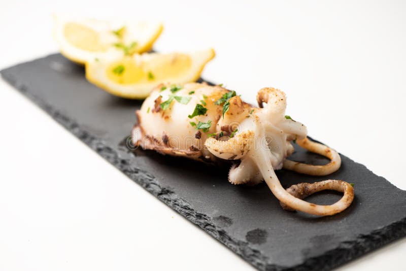 Delicious BBQ Cuttle Fish on a Stone Dish Stock Photo - Image of cooked ...