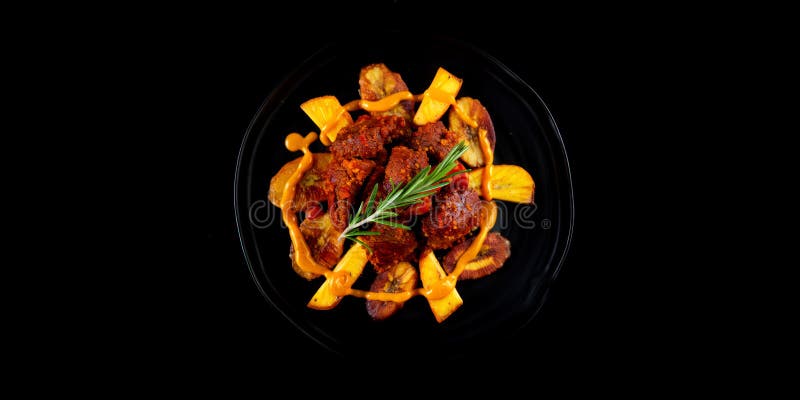 Delicious Beef Dish with Plantain and Pineapple Top View on a Black ...