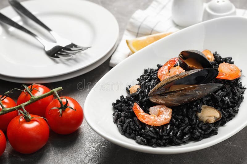Delicious Black Risotto with Seafood on Table Stock Photo - Image of ...