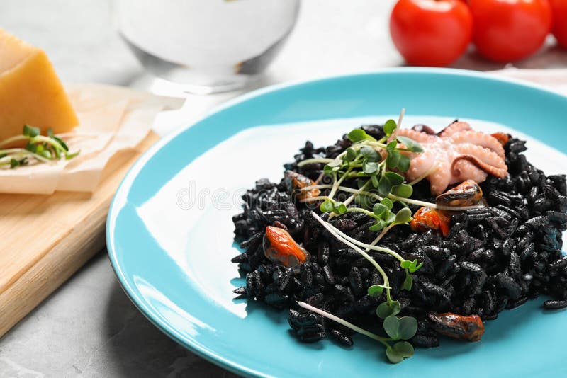 Delicious Black Risotto with Seafood on Table Stock Image - Image of ...