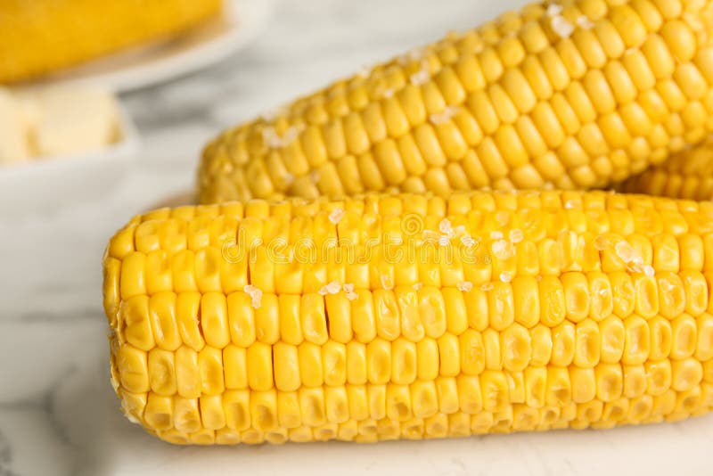 Delicious Boiled Corn with Salt on Table, Closeup Stock Image - Image ...