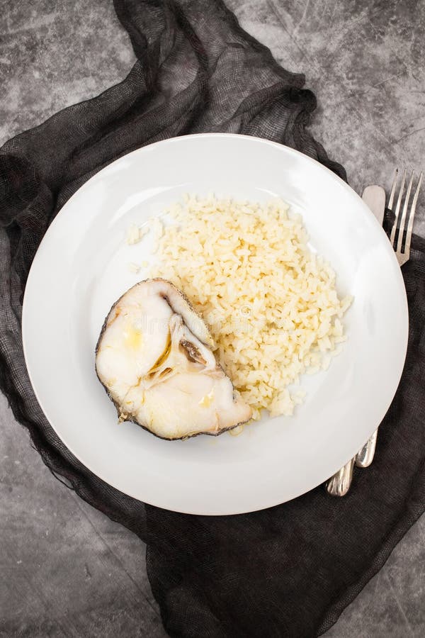 Delicious Boiled Fish with Boiled Rice on Plate Stock Photo - Image of ...
