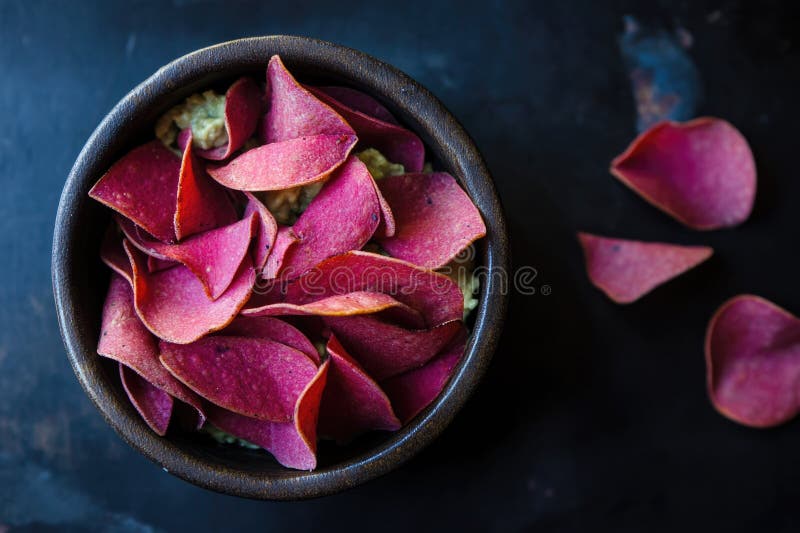 Delicious Bowl of Crunchy Red Vegetable Chips on Dark Background Stock ...