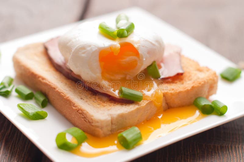 Delicious Breakfast. Eggs Benedict with Ham on Toast. Stock Photo ...