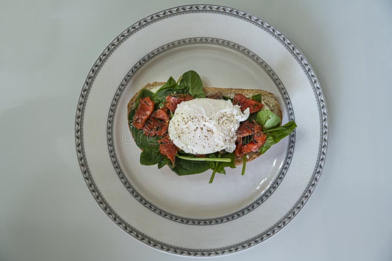 Delicious Breakfast Poached Egg on a Slice of Ciabatta with Spinach and ...