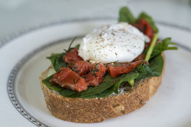 Delicious Breakfast Poached Egg on a Slice of Ciabatta with Spinach and ...