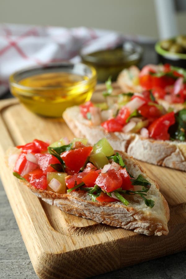 Delicious Bruschetta Snacks on Gray Textured Table Stock Photo - Image ...