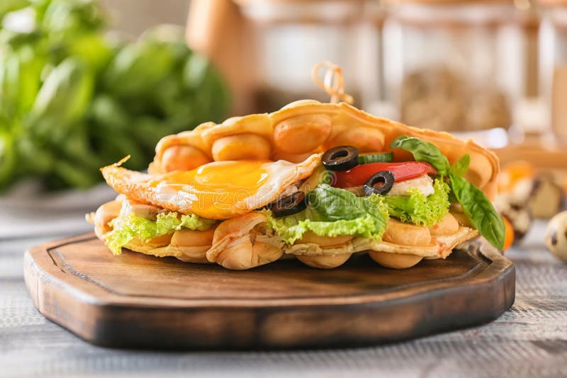 Delicious Bubble Waffle with Fried Egg on Wooden Board Stock Photo ...