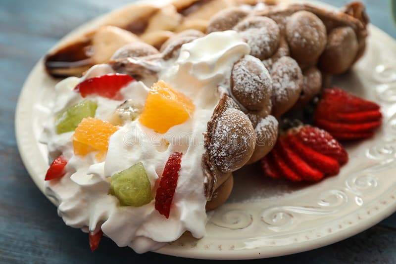 Delicious Bubble Waffle on Plate Stock Image - Image of table ...