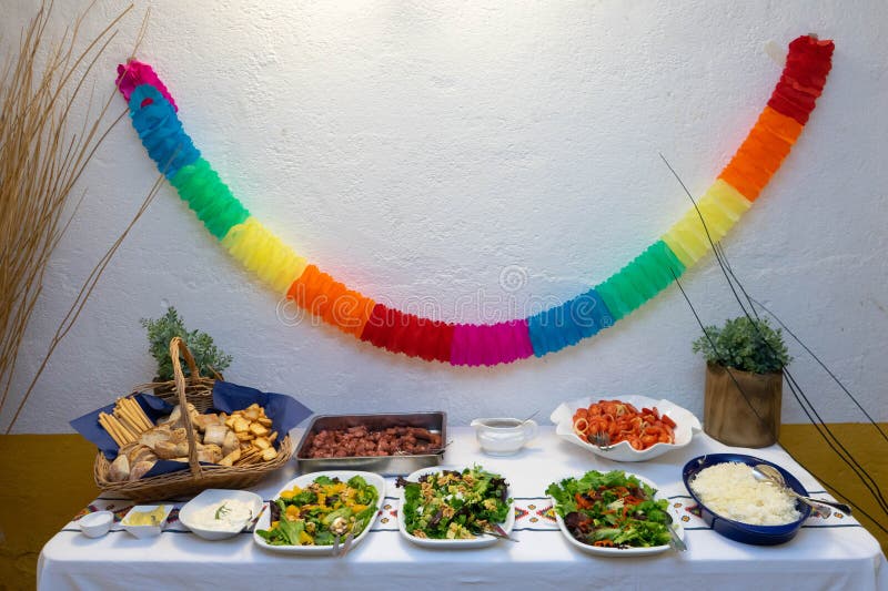 Delicious Buffet Spread: Assorted Bread, Sausages, Salads, and Rice ...