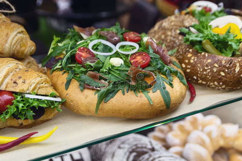 Delicious Bun with Bacon and Vegetables on Display at Bakery Stock ...